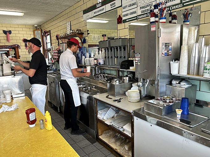 The white-aproned ice cream artisans at work—guardians of tradition who understand that making people happy is serious business.