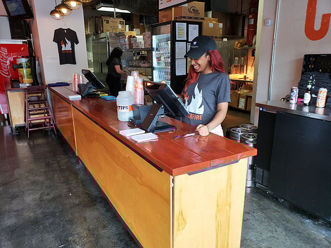 Behind every great hot chicken experience is a dedicated team member, ready to guide newcomers through their spicy journey.