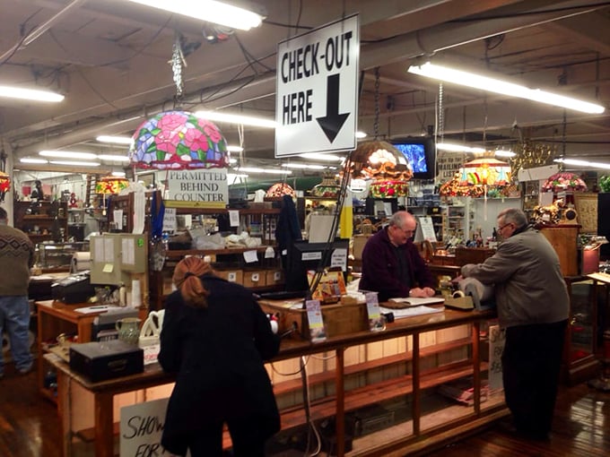 The checkout counter – where treasures and their new keepers make it official. Stained glass lamps cast a warm glow over transactions of history.