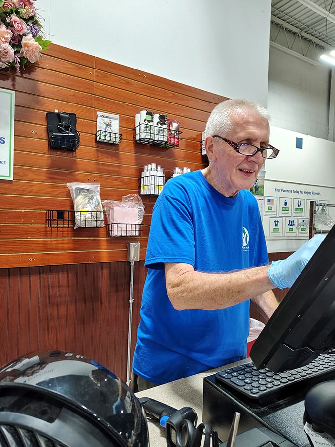 Behind every great thrift store is dedicated staff—this cheerful volunteer embodies the spirit of service that powers St. Vincent de Paul's mission.