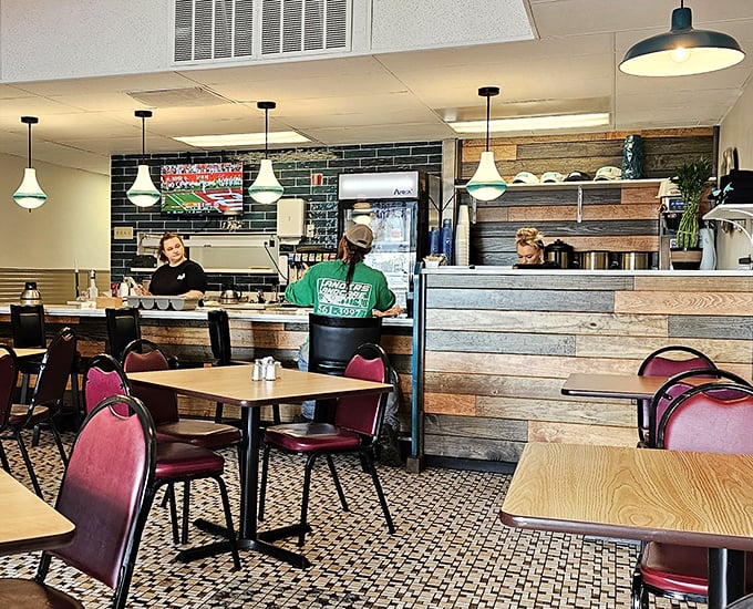 Where diner magic happens—staff working their breakfast choreography behind a counter that's seen thousands of coffee refills and "order up!" calls.