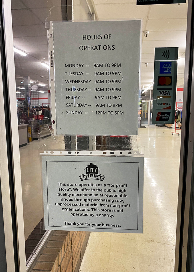 The hours of operation sign reveals the thrifter's schedule—generous windows of opportunity for treasure hunting almost every day.