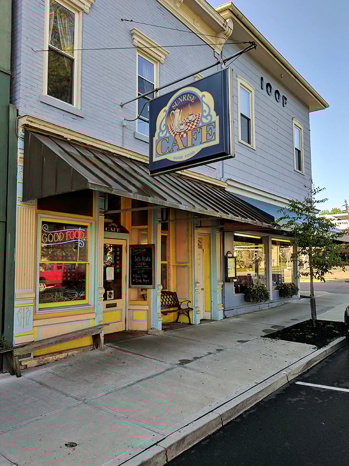 The Sunrise Cafe's cheerful exterior promises morning delights. That "GOOD FOOD" sign isn't just advertising—it's a solemn vow to your taste buds.