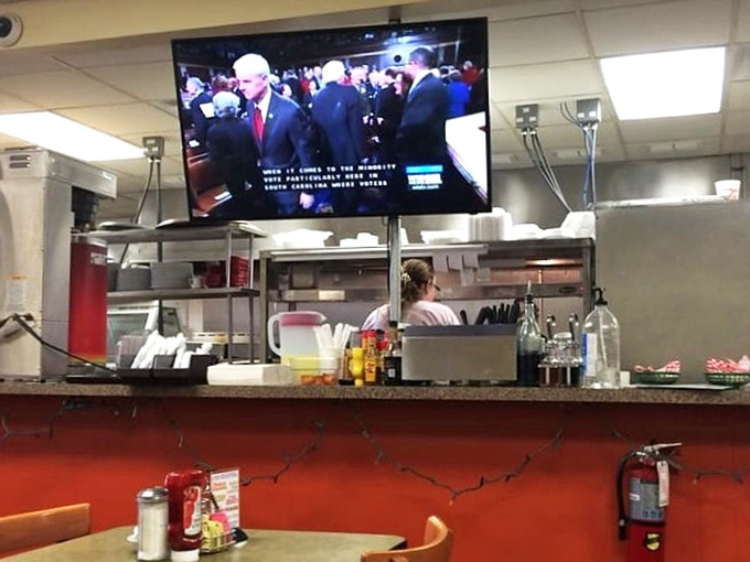 Where news meets nourishment. The kitchen TV keeps diners connected to the world while they disconnect from daily stresses.