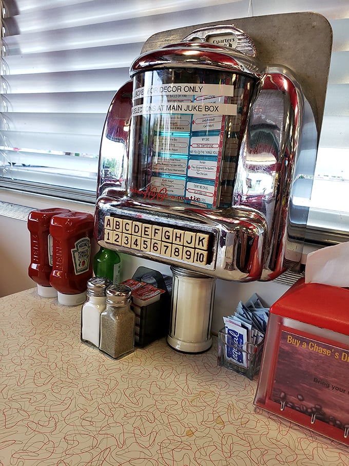 The tabletop jukebox—silent now but still promising three songs for a quarter and the soundtrack to countless diner memories.