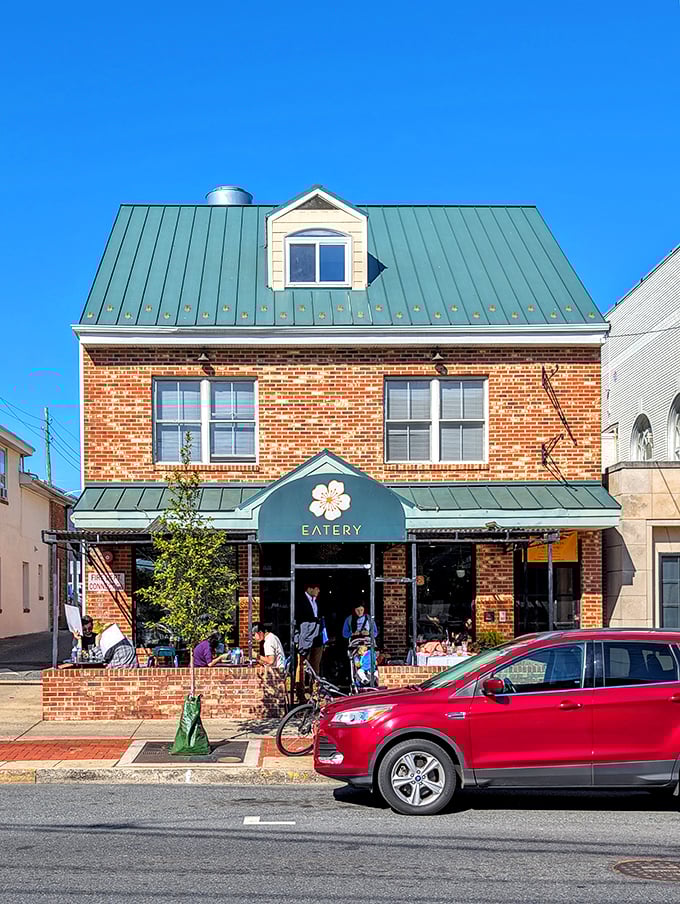 The Peach Blossom Eatery's charming brick façade and outdoor seating invite passersby to linger over locally-inspired cuisine and people-watching.