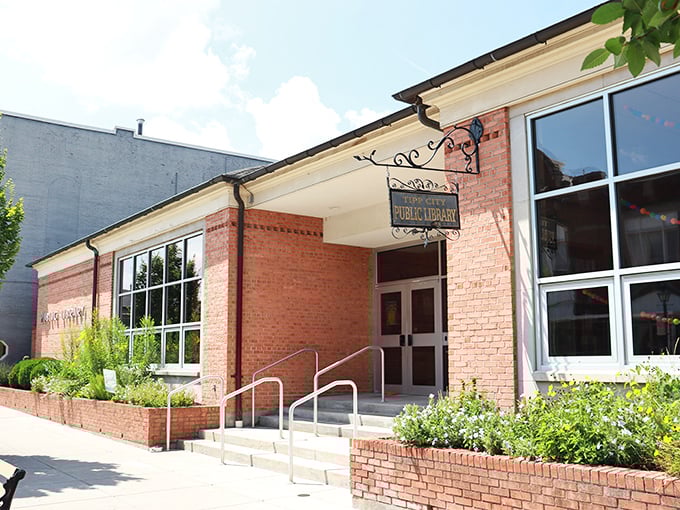 The Tipp City Public Library welcomes readers with classic brick charm and flowering gardens – because every good story deserves a beautiful setting.