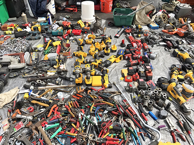Tool paradise spread across the pavement—a mechanical feast where DIY dreams and fix-it fantasies come to life for fraction of retail.