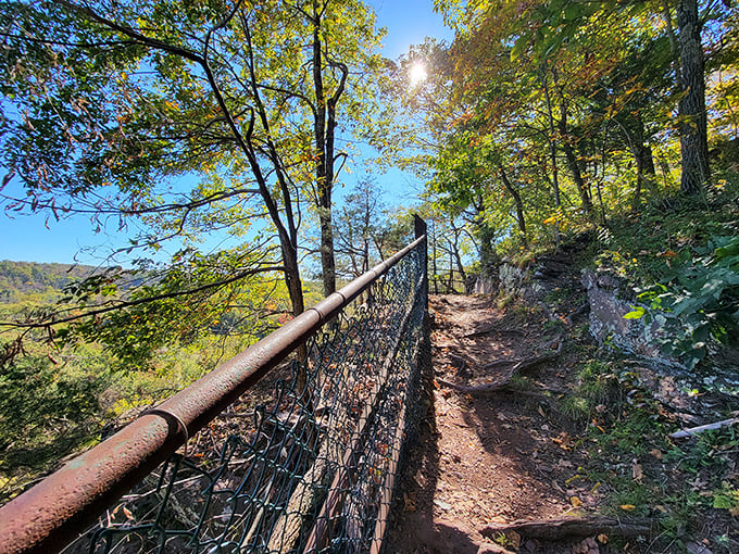 The cliff-edge trail offers thrills with each step. That handrail isn't just for decoration—it's the difference between sightseeing and skydiving.