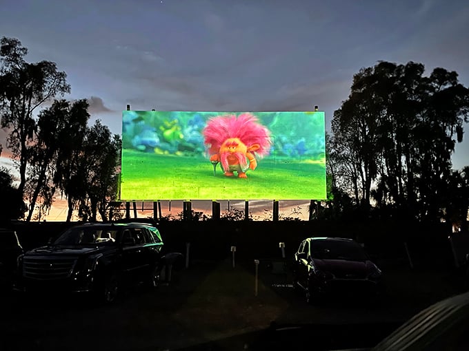 Animation comes alive against the darkening sky—proof that pixels projected outdoors somehow feel more magical than on your living room TV.
