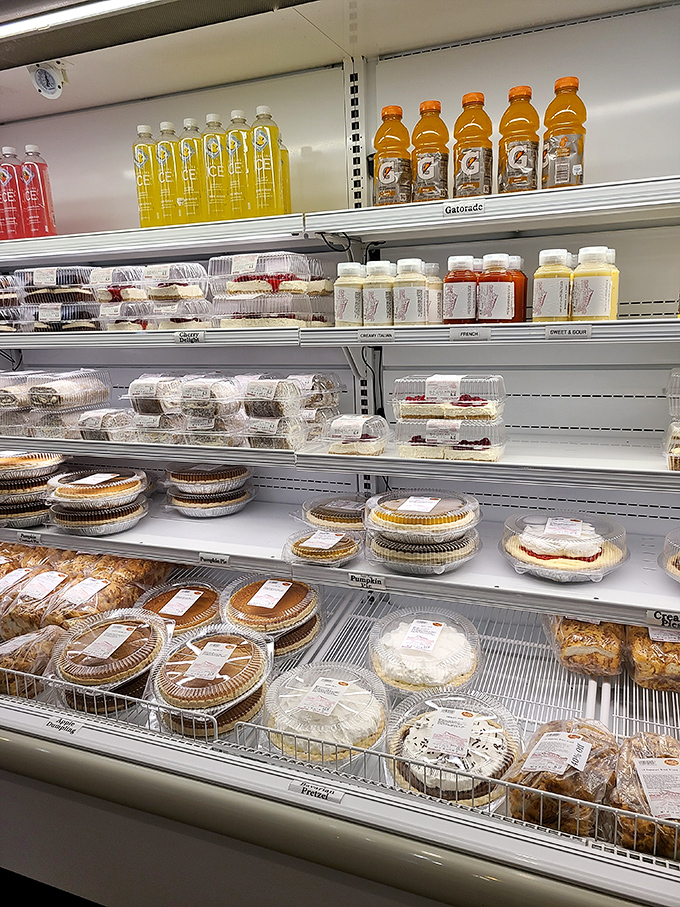 The market's refrigerated section—where you can take home a slice of Amish Country magic. Diet resolutions come here to die.