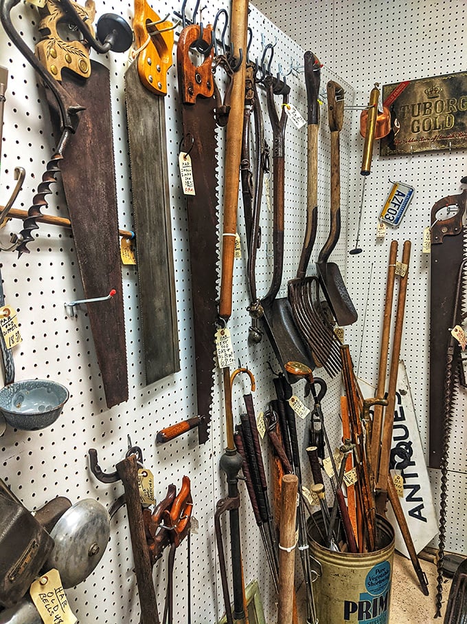 Tools that built America, now hanging as artifacts of craftsmanship. Before power tools, these hand-forged implements shaped our world one swing at a time.