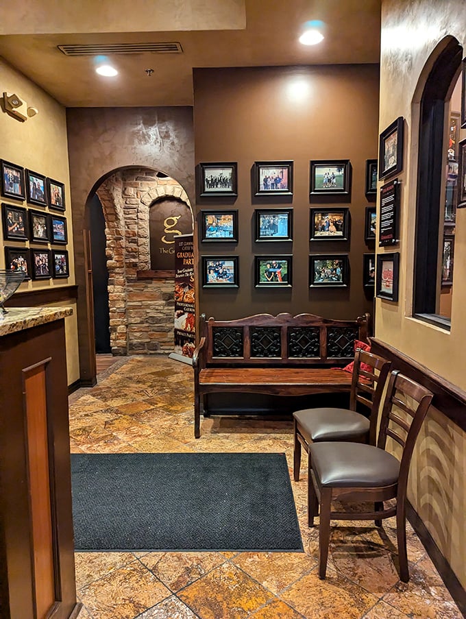 The waiting area's photo wall tells stories of community connections – a visual reminder that in Italian culture, restaurants aren't just places to eat, but to belong.