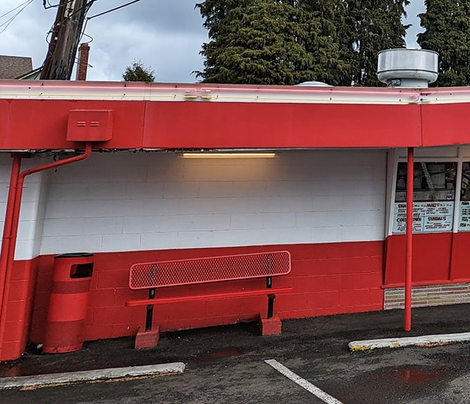 The simple red bench - where countless Tacomans have experienced that moment of anticipation between ordering and first bite.