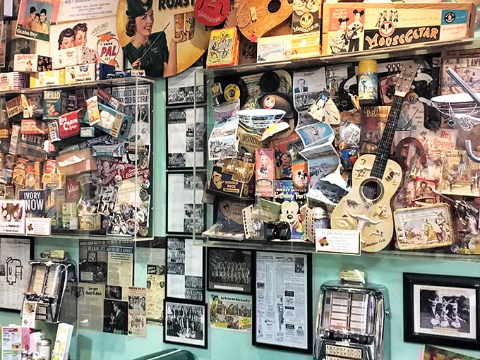 This isn't decoration; it's documentation – a visual history of American pop culture where Mickey Mouse hangs out with Elvis memorabilia in perfect harmony.
