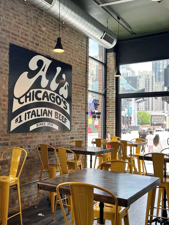 The interior showcases Al's signature style—exposed brick, that iconic logo, and yellow chairs ready to welcome hungry Chicagoans.