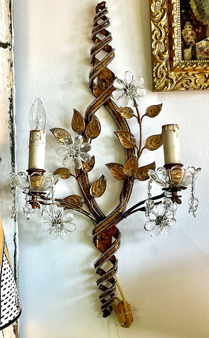 Wall sconces that combine crystal flowers and twisted metal—like jewelry for your walls that also happens to light them.