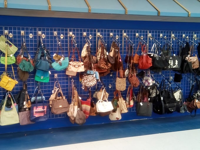 The handbag wall displays a rainbow of leather and vinyl possibilities—yesterday's arm candy waiting for today's fashionable embrace.