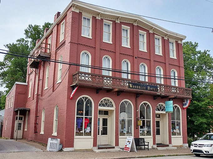 The Woodruff Hotel's brick facade and iron balcony whisper tales of travelers from a more elegant era.