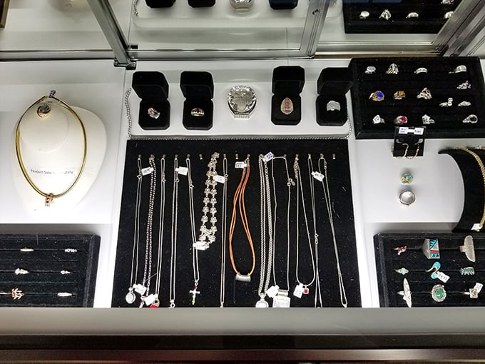 The jewelry display case offers a dazzling array of possibilities—from statement necklaces to rings that could start conversations.