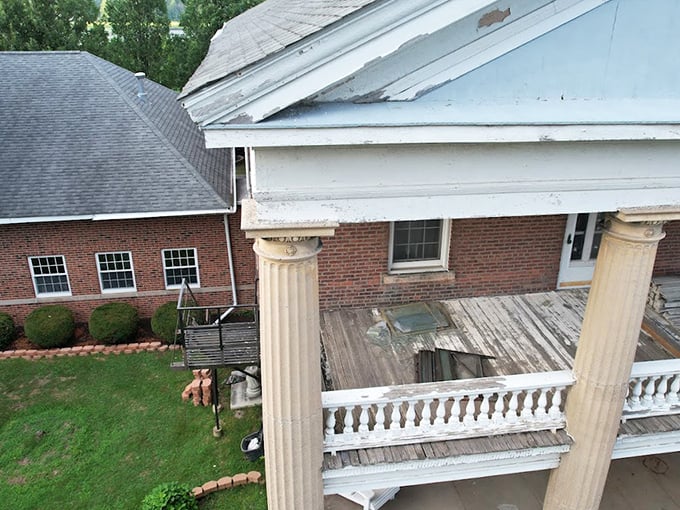 Even structural damage can't diminish the architectural grandeur of this historic porch, though you might want to watch your step.