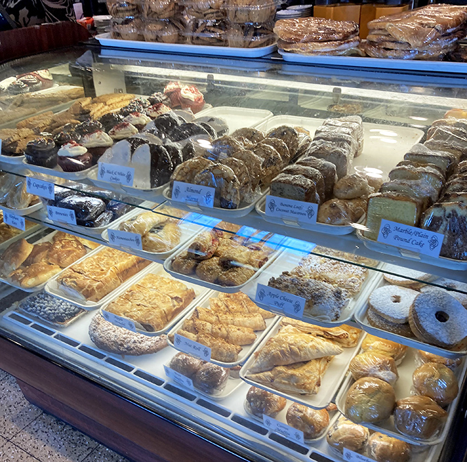 The dessert case – where willpower goes to die. A glass-enclosed gallery of baked masterpieces that makes "I'll just look" the biggest lie in dining.