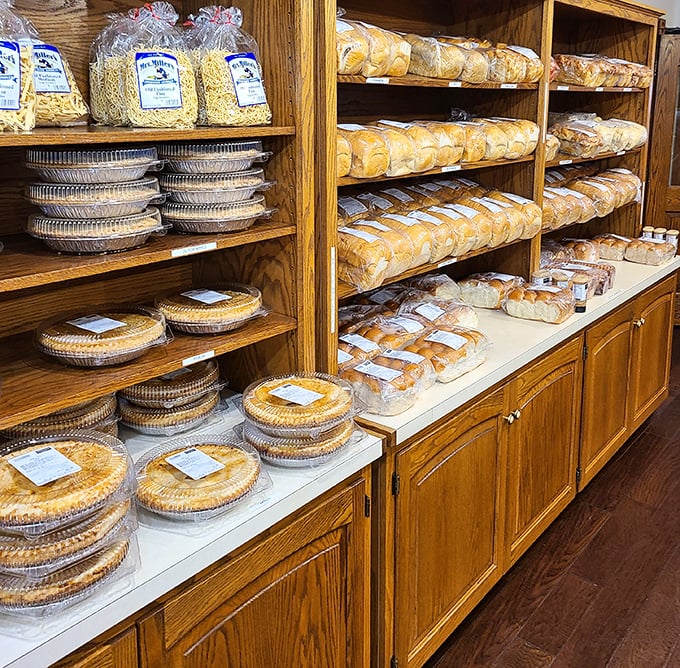 Shelves lined with homemade pies and breads—carbohydrate heaven with a side of nostalgia. Each plastic container holds someone's future food memory.
