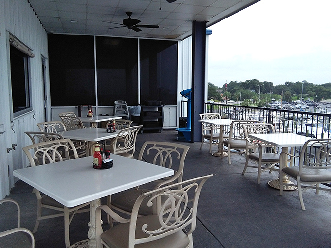 Outdoor dining with a harbor view—where the gentle Gulf breeze serves as both seasoning and air conditioning.