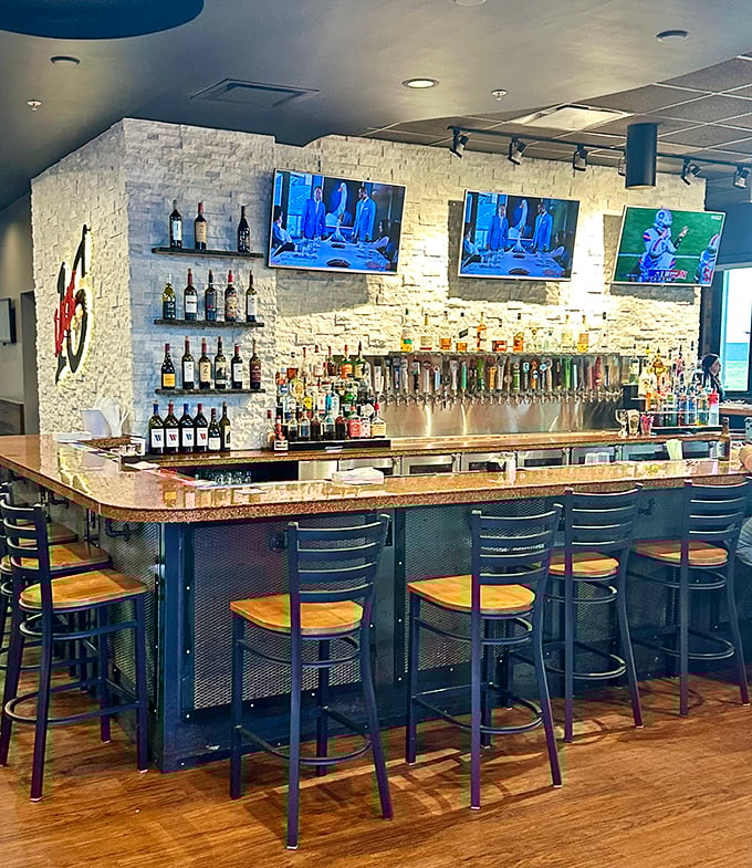 The bar area – where strangers become friends and friends become regulars over perfectly poured drinks and shared appetizers.