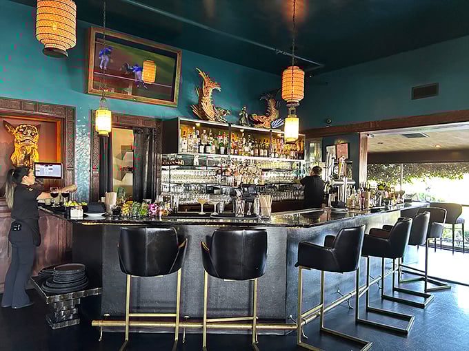 The emerald-hued bar area channels vintage Shanghai glamour with golden accents that make every drink feel like a special occasion.