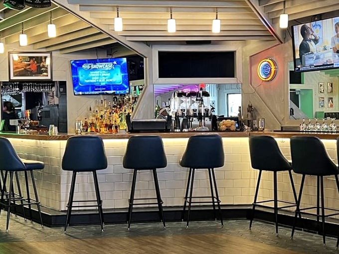 The bar area strikes that perfect balance between "I'm on vacation" and "I'm a local"—a gathering place where stories flow as freely as the drinks.