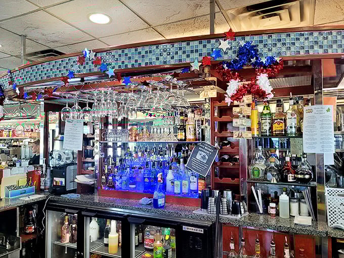 The bar sparkles with promise, where evening comfort comes in liquid form after a day when "you deserve a drink" isn't just a saying, it's a mathematical certainty.
