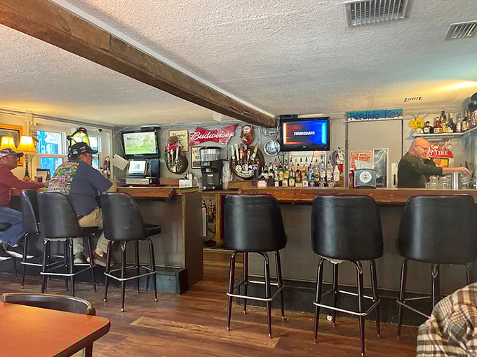 The bar area—where locals gather to debate important matters like football, fishing spots, and who makes the best key lime pie.