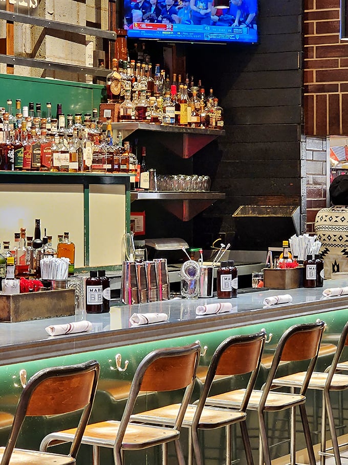 The bar at Mabel's isn't just stocked—it's an arsenal of liquid happiness, where bourbon bottles stand like soldiers ready to enhance your barbecue experience.