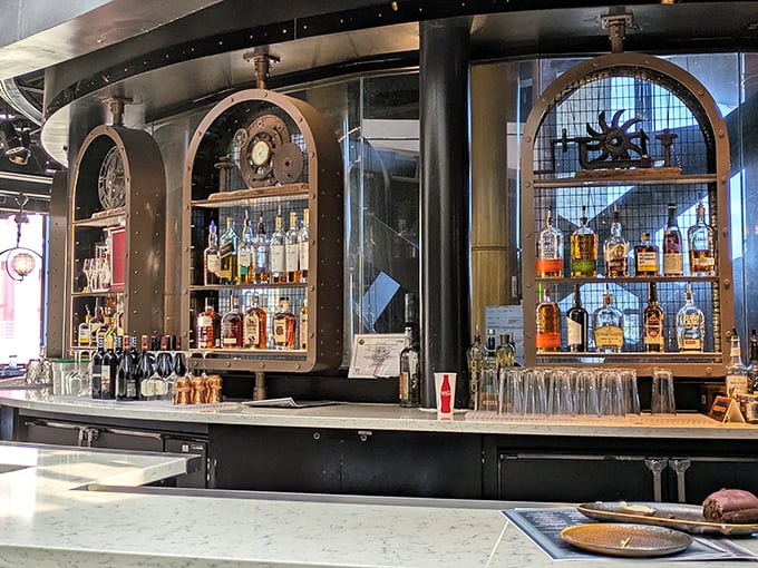 This isn't just a bar—it's a liquid laboratory where spirits are displayed in brass-framed cabinets like rare scientific specimens. Edison would approve.