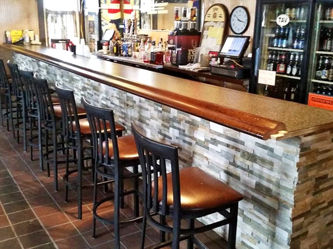 A bar that understands the importance of elbow room and cold beer. That stone facade isn't just pretty—it's supporting countless stories.