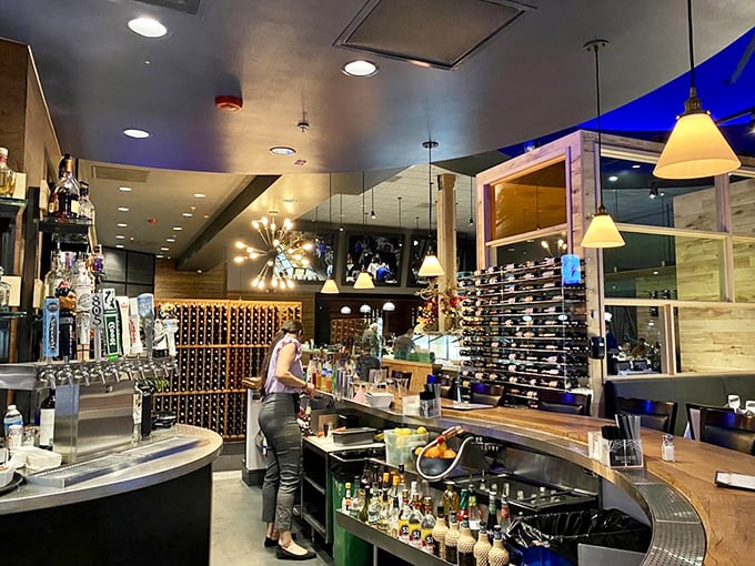 The bar doesn't just serve drinks—it's command central for an evening of strategic indulgence. Those wine bottles stand ready for your selection.