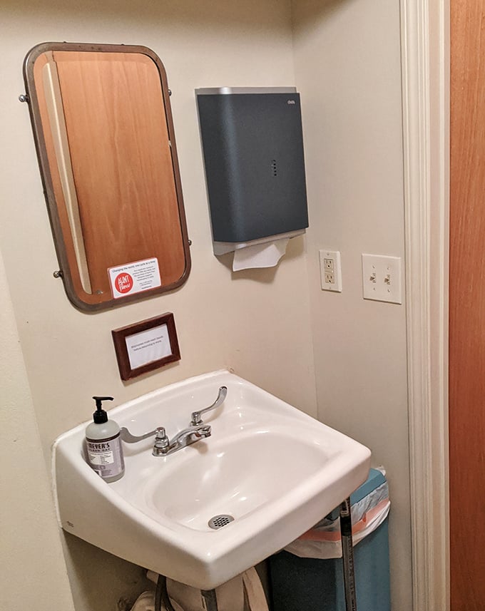 Even the bathroom has charm—a vintage mirror and simple sink. No detail overlooked in this temple to tastiness.
