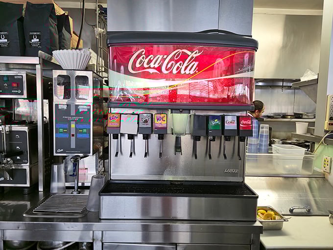 The soda fountain stands ready for service—because sometimes coffee alone can't handle the job of washing down that perfect breakfast.