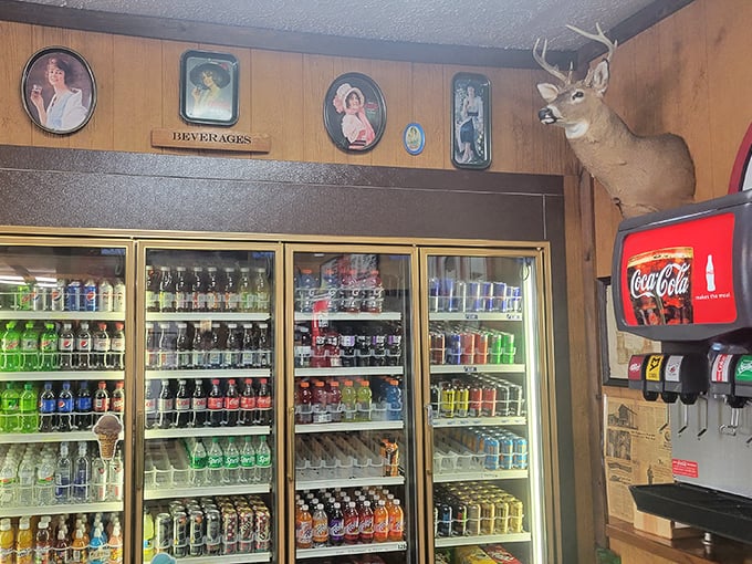 The beverage cooler—where thirst goes to surrender. That vintage Coca-Cola sign has been tempting customers since before smartphones existed.