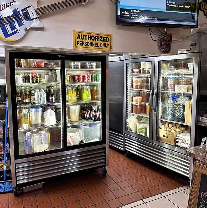 The beverage coolers – a colorful array of Mexican sodas and homemade sauces. That's not just inventory – it's liquid happiness waiting to be poured.