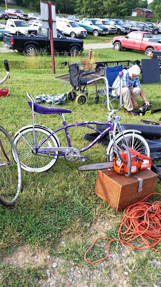 Wheels of fortune! This vintage bicycle sits patiently beside modern power tools—the perfect metaphor for the flea market's timeless appeal.