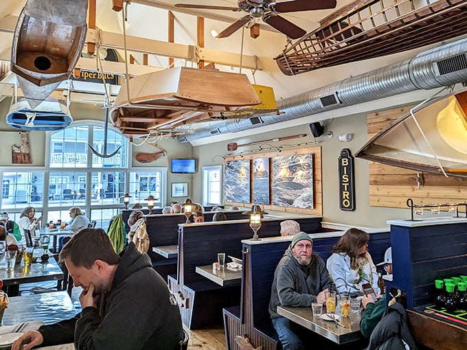 Cozy booths where seafood dreams come true. That wooden boat overhead isn't just watching you eat—it's silently judging your seafood ordering skills.
