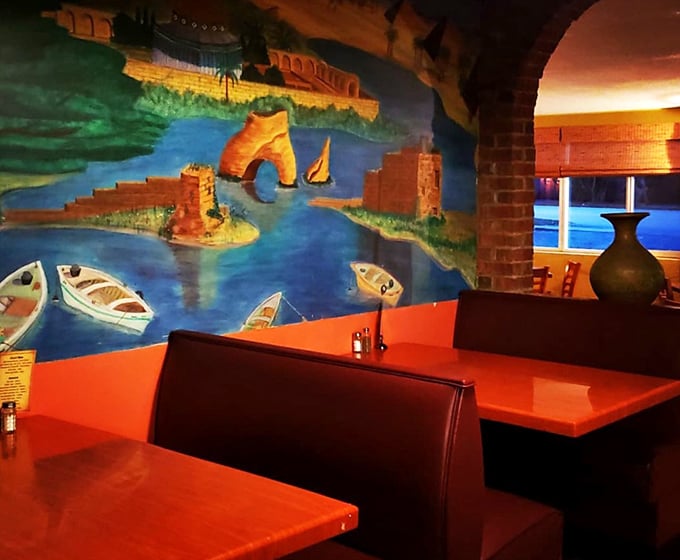 A vibrant mural transports diners to Mediterranean shores. Who needs a plane ticket when you have paintbrush and flavor?