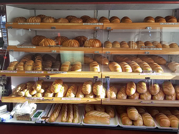 Bread loaves lined up like soldiers ready for duty – each one sworn to make your sandwich dreams come true.
