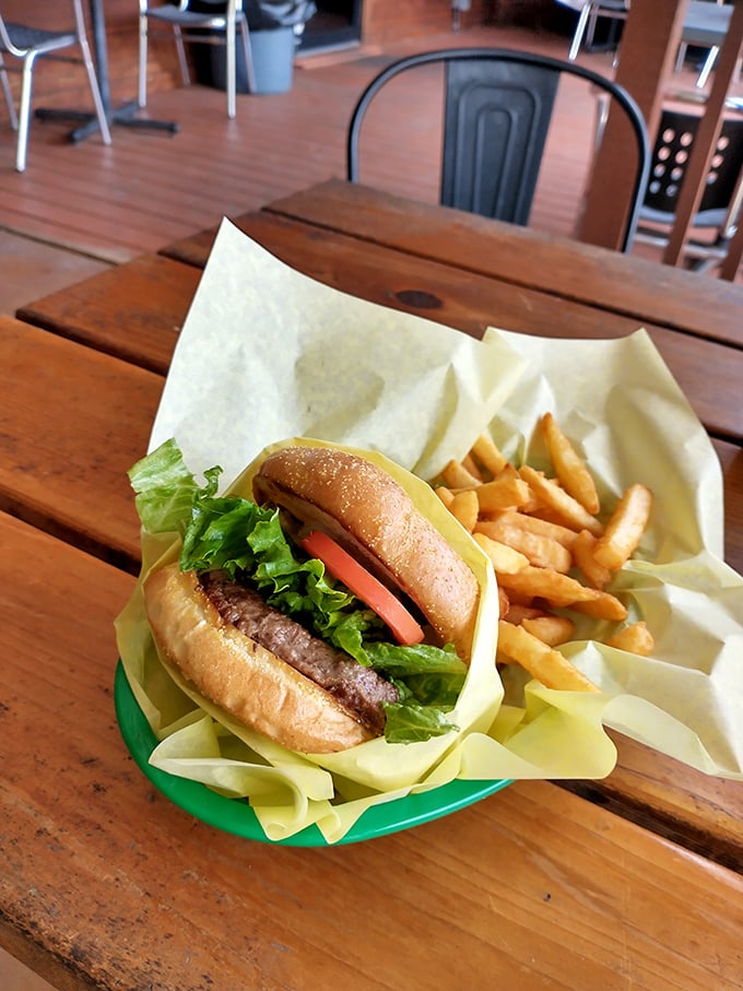 A burger that doesn't need fancy toppings or a pretentious name – just honest beef, fresh veggies, and a bun that knows its supporting role perfectly.