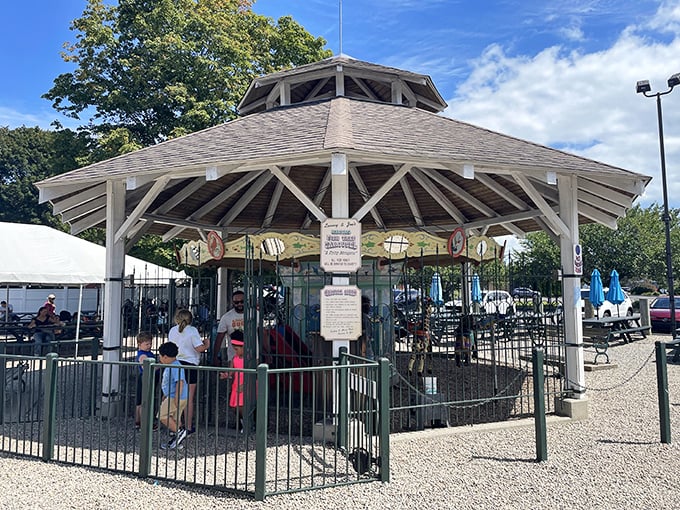 Not just any carousel—a beloved local tradition where kids ride while parents digest, creating the perfect seafood dinner intermission.