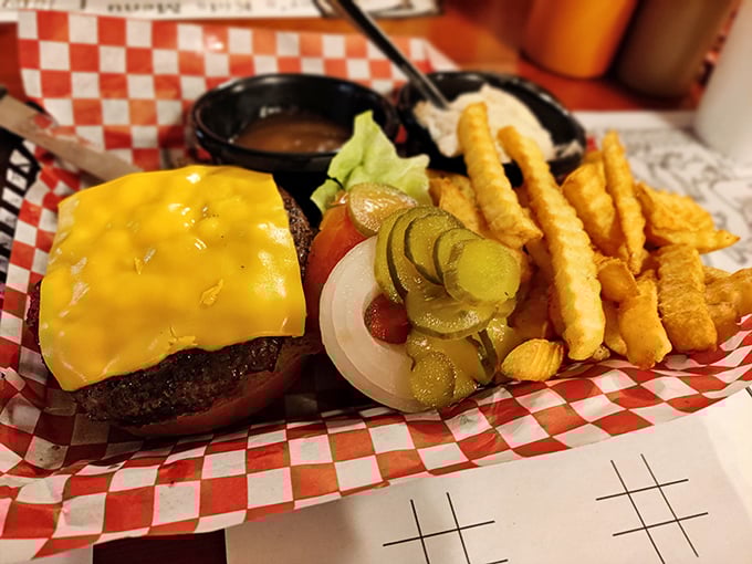A cheeseburger that doesn't need to be deconstructed or reimagined—just perfectly executed with a golden cheese blanket and crispy fries standing at attention.