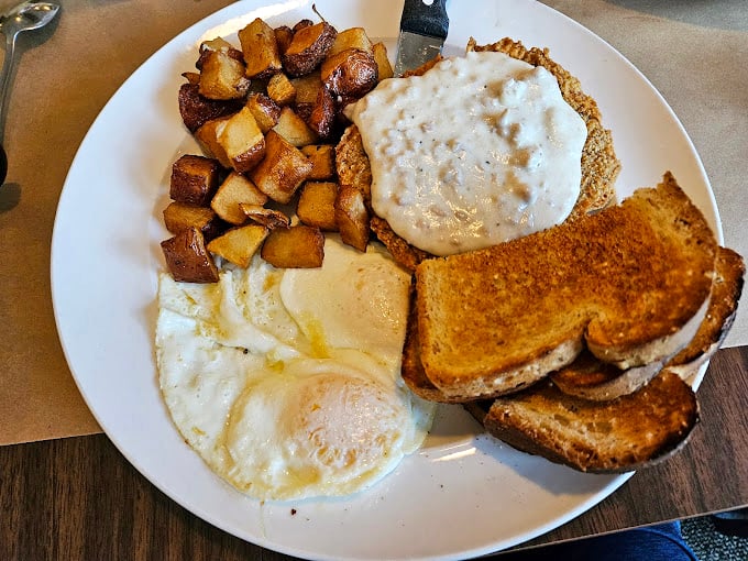The full breakfast spread—eggs, potatoes, toast, and that glorious country gravy. This plate doesn't just feed your body; it nourishes your Midwestern soul.
