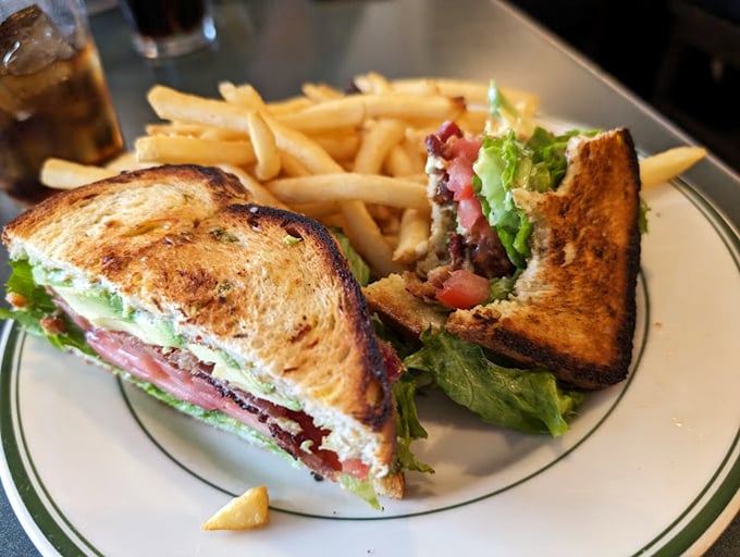 The club sandwich—that reliable friend who never lets you down, accompanied by fries that clearly didn't come from a freezer bag.